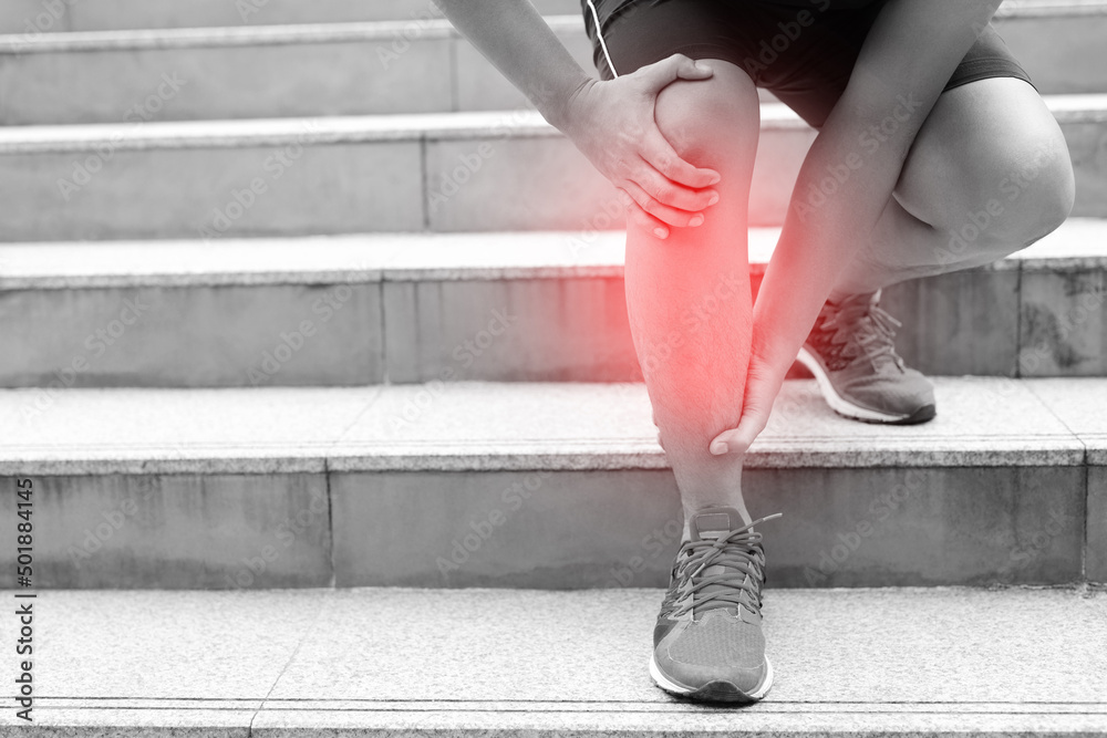 Runner touching painful twisted or broken. Athlete training, running up ...