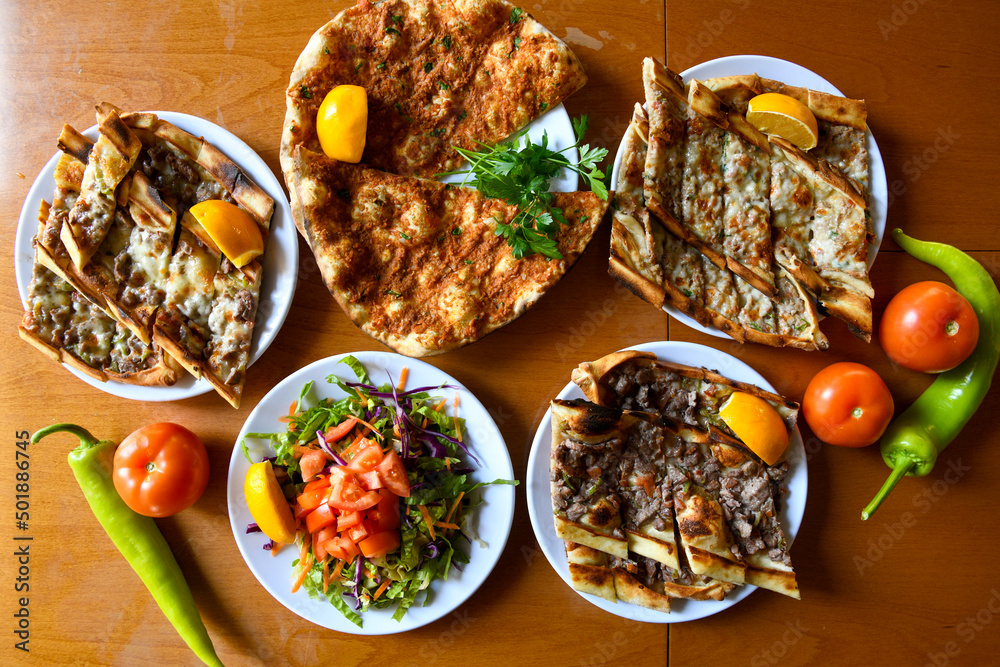 Traditional Turkish cuisine. Pizza, pita, pidesi, sucuk, hummus, kebab ...