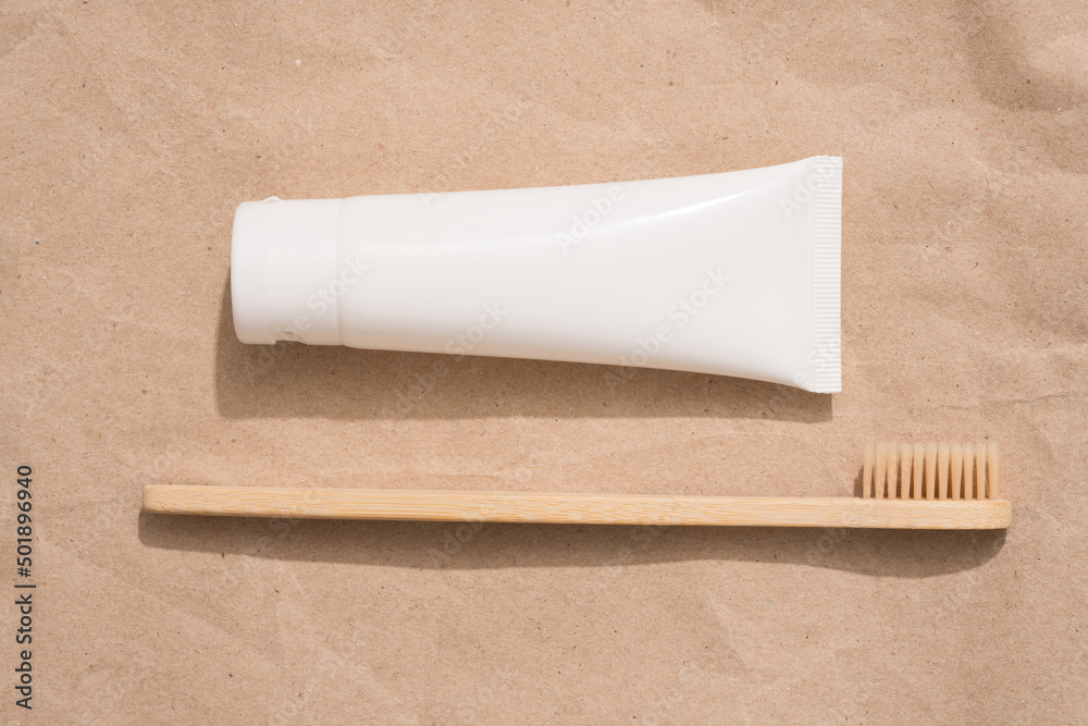 Wooden bamboo toothbrush and tube with organic mineral toothpaste on ...