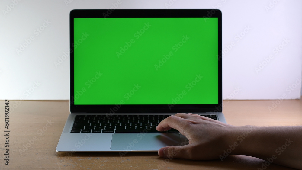 Chroma key green screen laptop, using space bar Stock-Foto | Adobe Stock