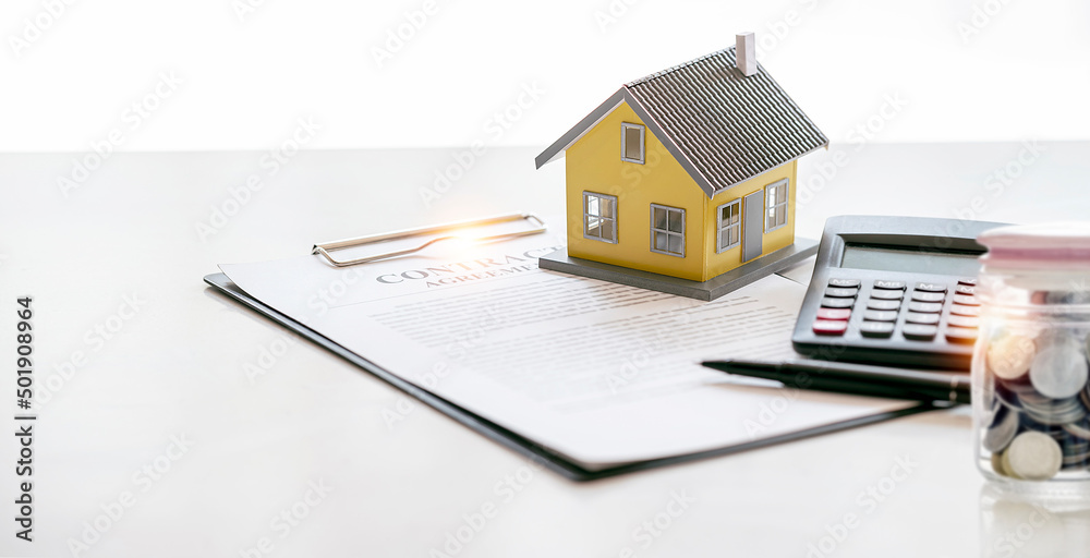 Real estate property background concept. House model on house contract ...