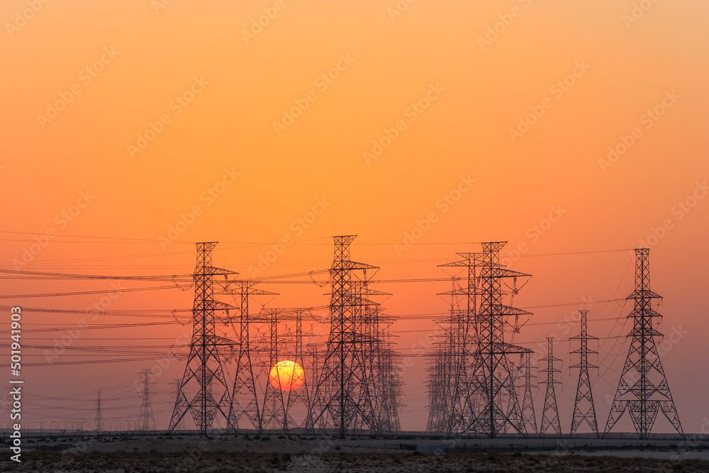 High-voltage power lines in Saudi Arabia (KSA) at sunset or sunrise ...