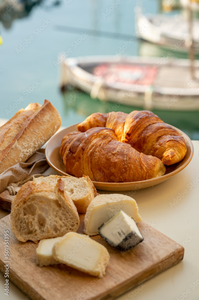 Sunny morning in Provence, breakfast with fresh baked croissants ...