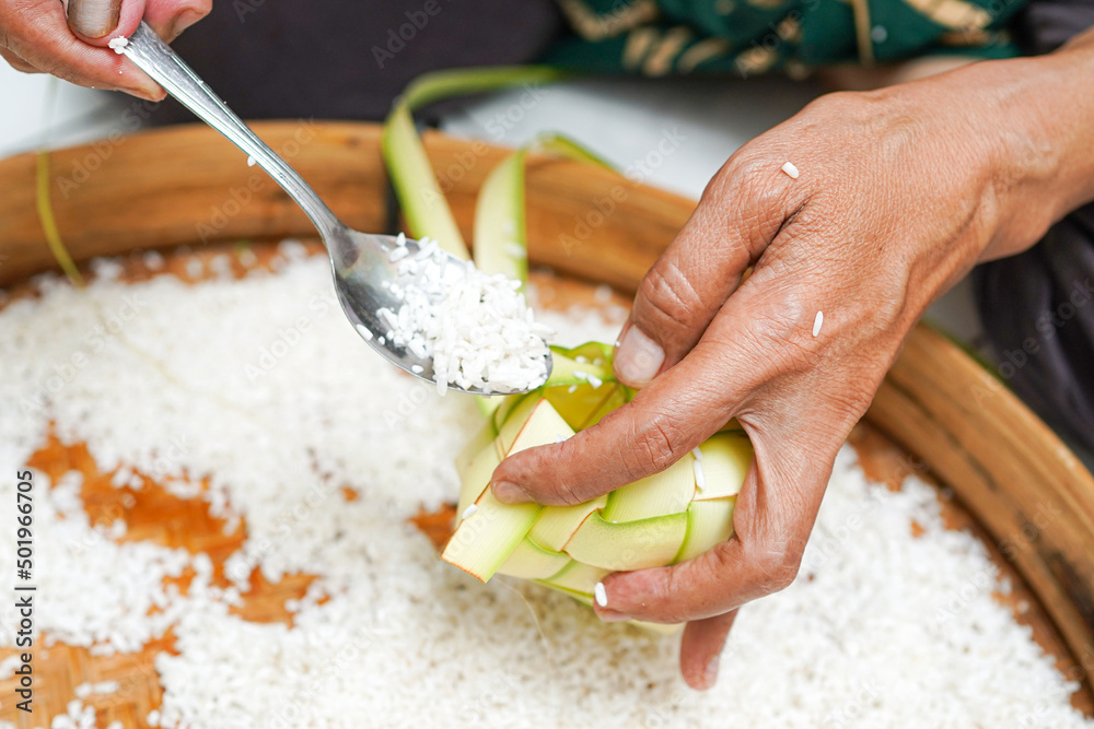 The process of making ketupat is a traditional food during Eid. Put the ...