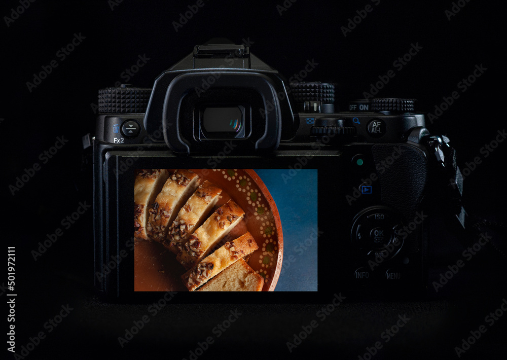 DSLR camera or mirrorless body lit by a rim light showing sweet bread ...