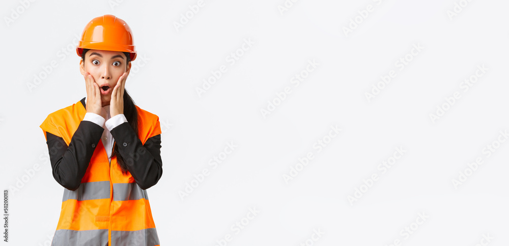 Foto de Shocked and concerned asian female engineer having problem at ...