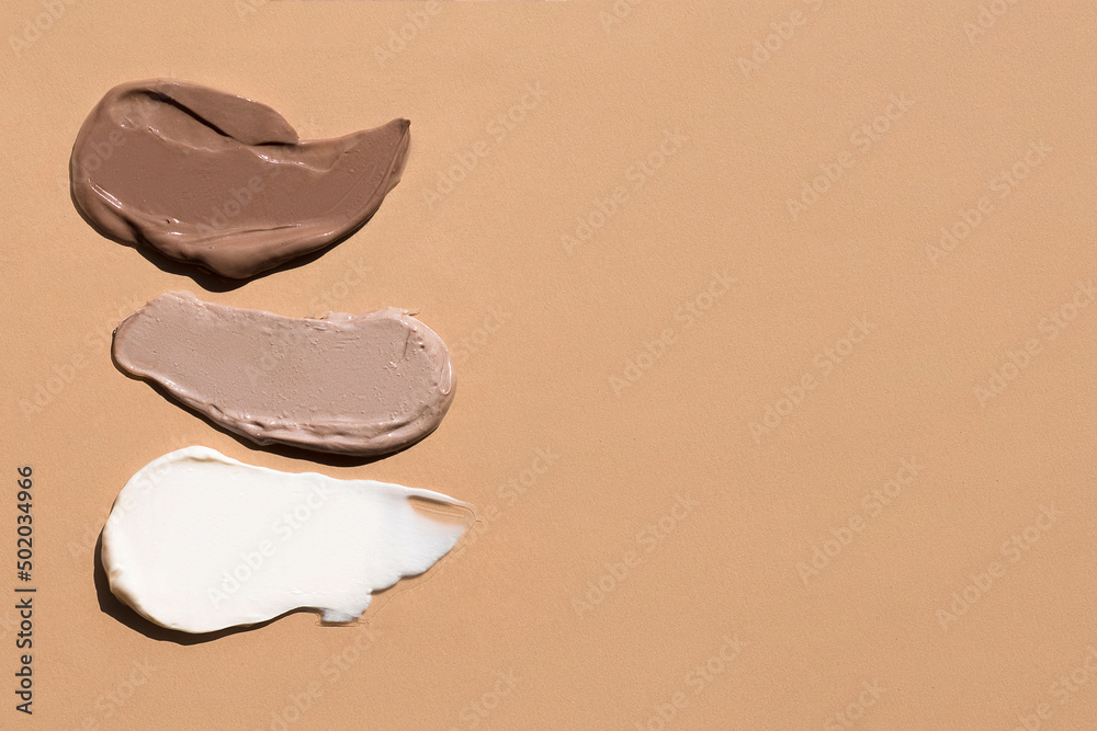White cream texture on a pastel beige background. Cosmetic mask balm ...