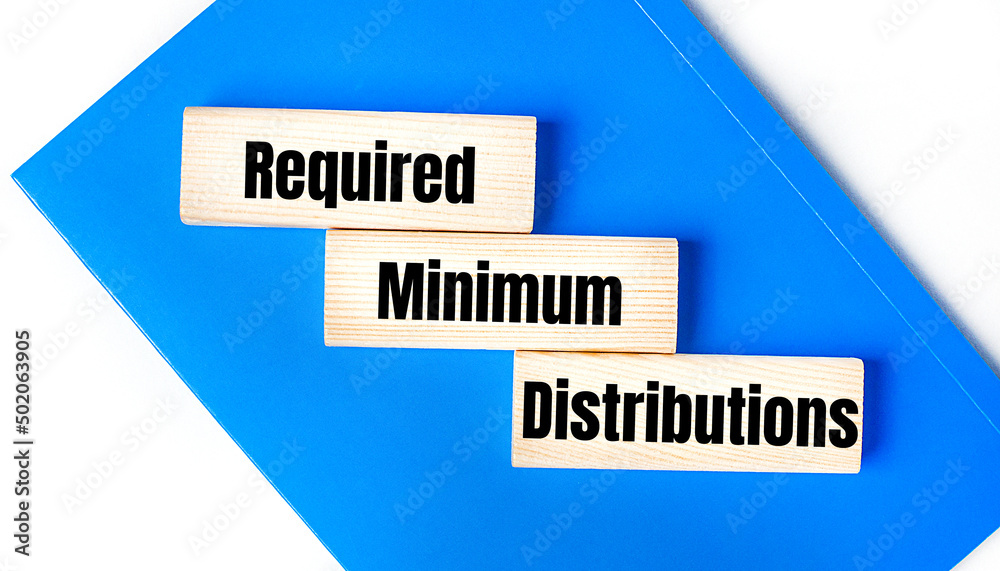 There is a blue notebook on a light gray background. Above are three ...