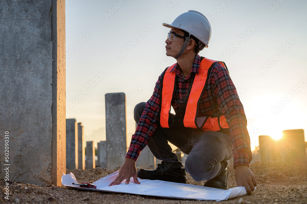 Construction engineers survey checkpoints of concrete pile, load ...