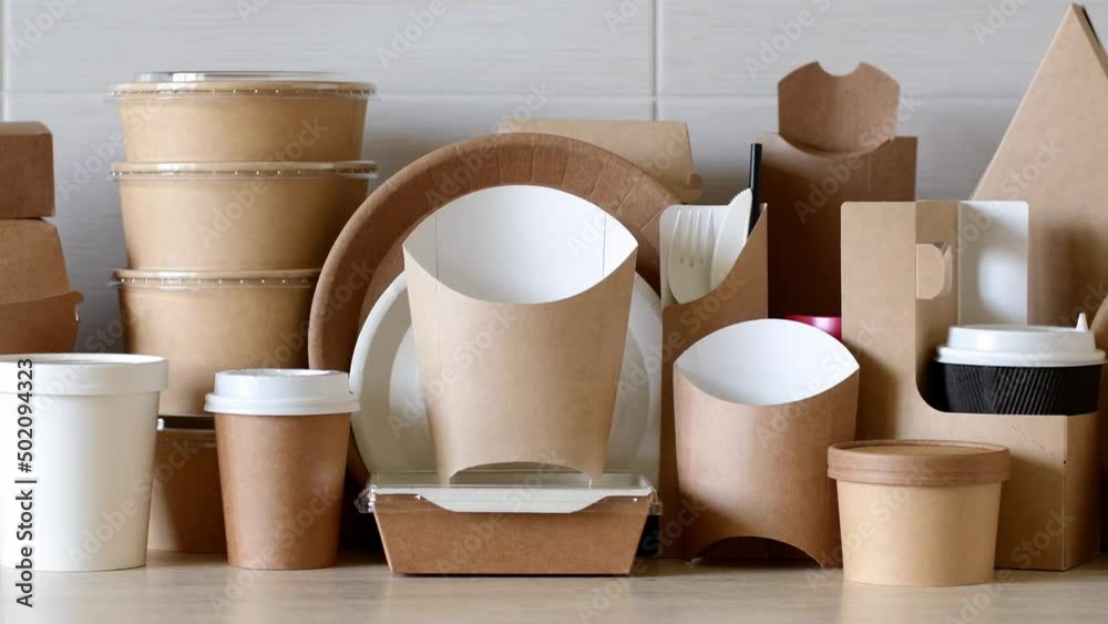 Paper eco-friendly disposable tableware. A large set of dishes and ...