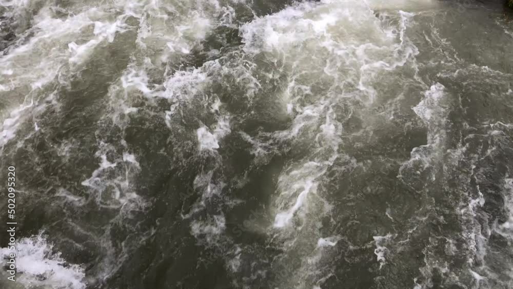 4K video. The flow of a mountain river. Natural background. Fast water ...