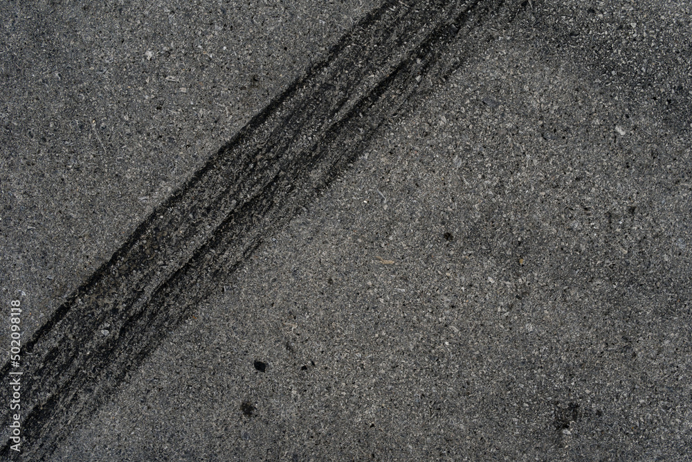 Asphalt texture with white line and tire marks. Smooth asphalt road ...