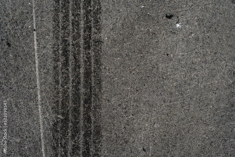 Asphalt texture with white line and tire marks. Smooth asphalt road ...