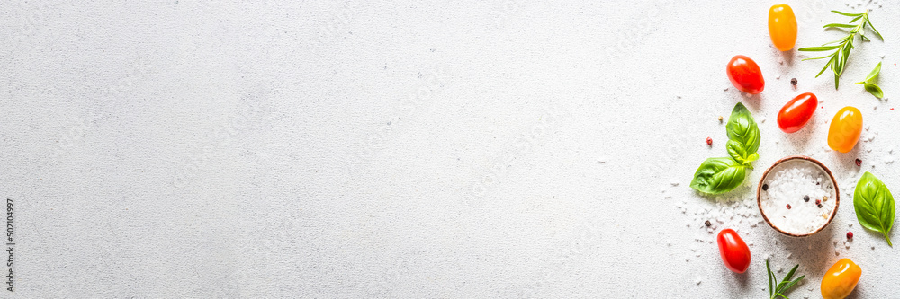 Food cooking background on white stone table. Fresh vegetables, herbs ...