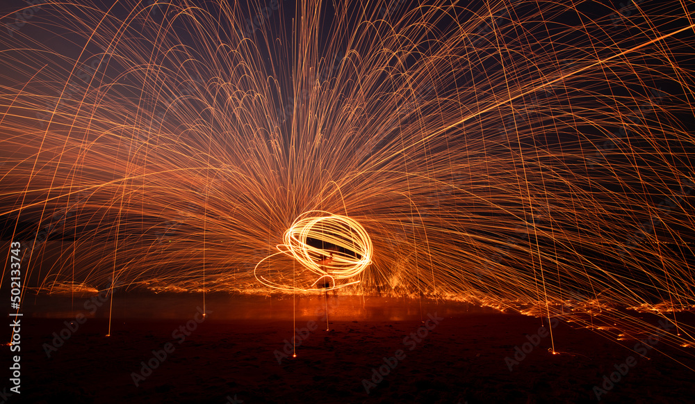 Fire dancer under show swing fire dancing on the beach ,he dance ...