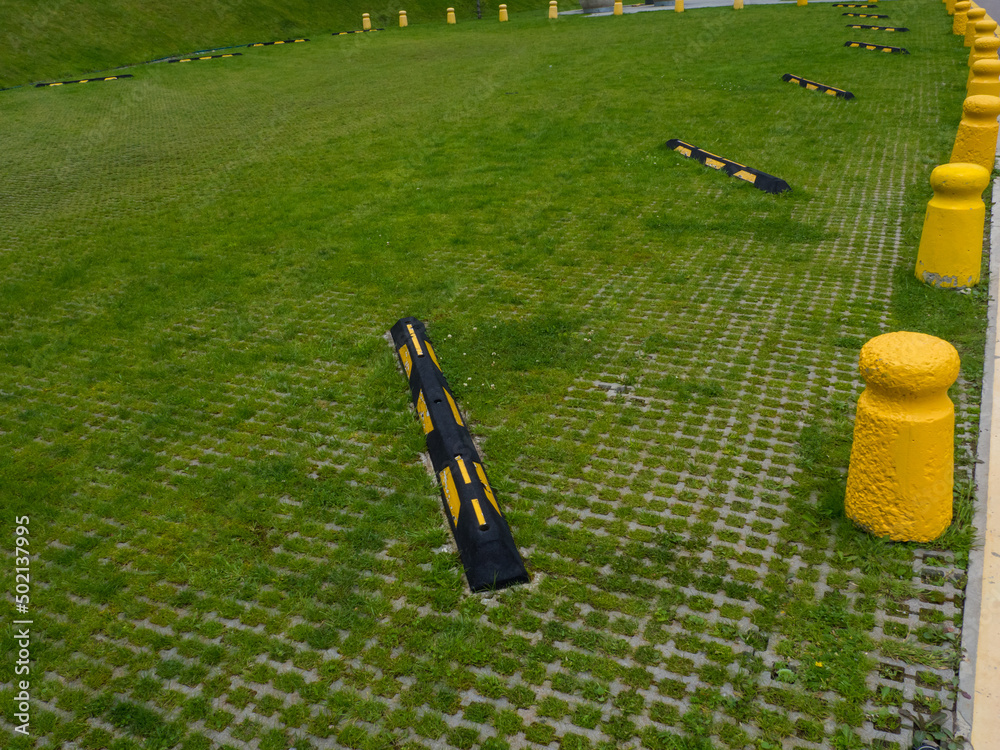 Eco-friendly parking of concrete cells and turf grass in summer. Modern ...