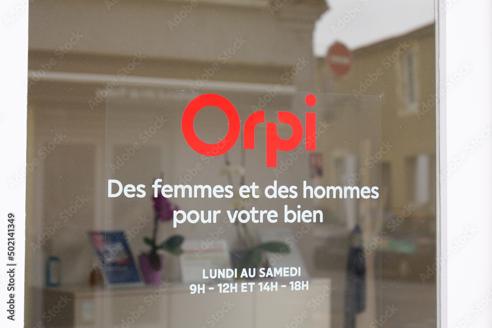 orpi sign logo and brand text office real estate red on windows door ...