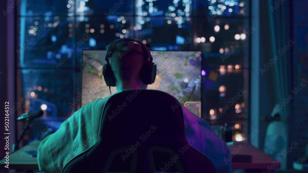 Back of the Head Angle of a Stylish Gamer Winning in a Video Game on ...