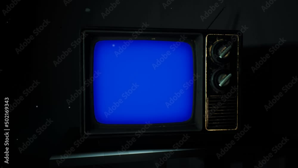 TV with a blue screen. A man in a hazmat suit watches TV in a creepy ...