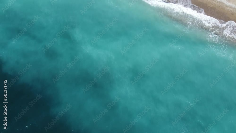 A flight over the blue sea flying to the village beach. High quality ...