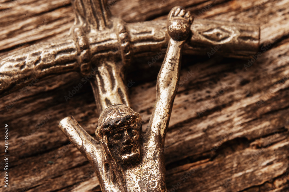 Partially destroyed ancient statue of the crucifixion of Jesus Christ ...