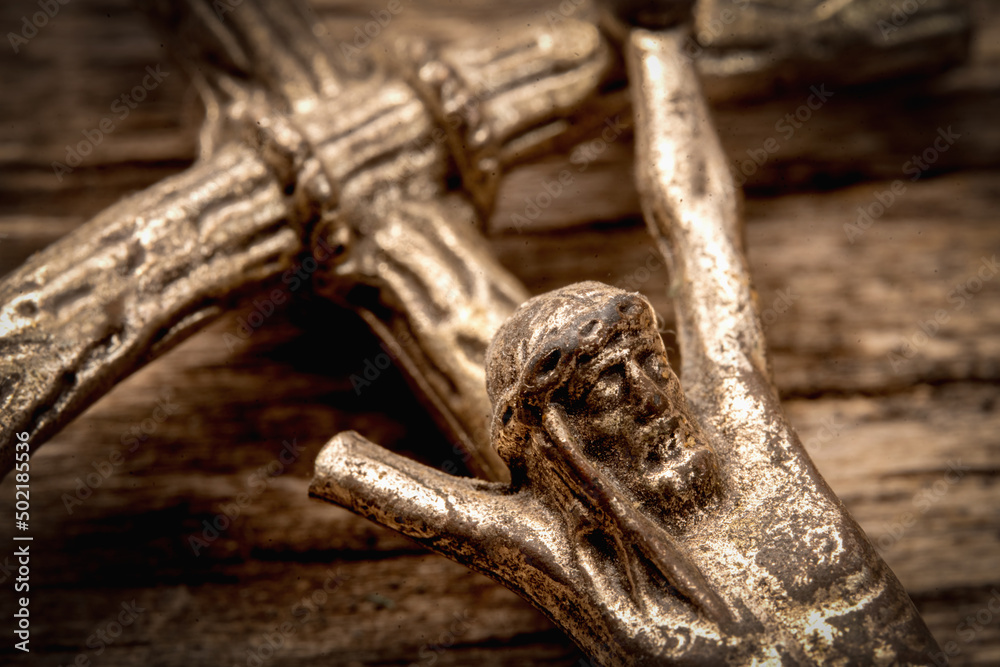 Partially destroyed ancient statue of the crucifixion of Jesus Christ ...