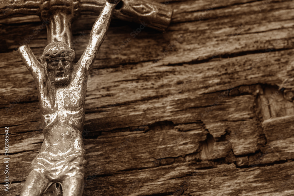 Partially destroyed ancient statue of the crucifixion of Jesus Christ ...