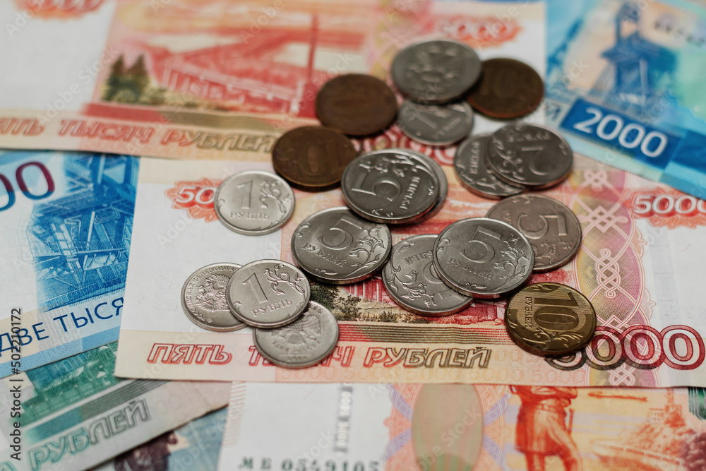 Russian banknotes and coins with a nominal value of 1, 5 and 10 rubles ...