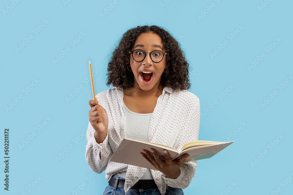 Excited young black female student having brilliant idea, finding ...