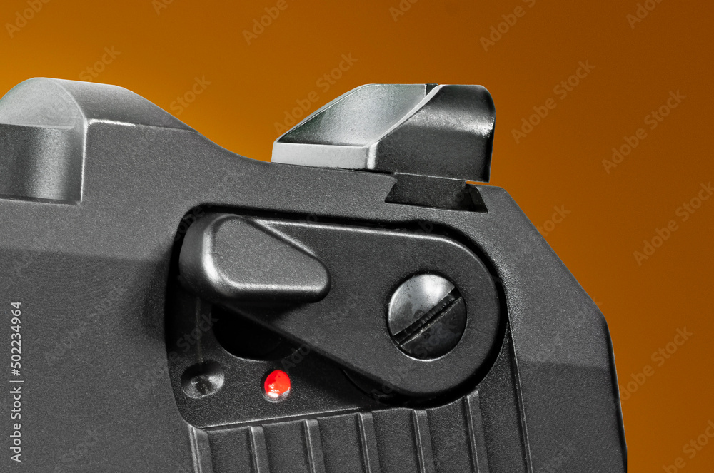 Red signalling the safety off on a semi automatic pistol Stock Photo ...