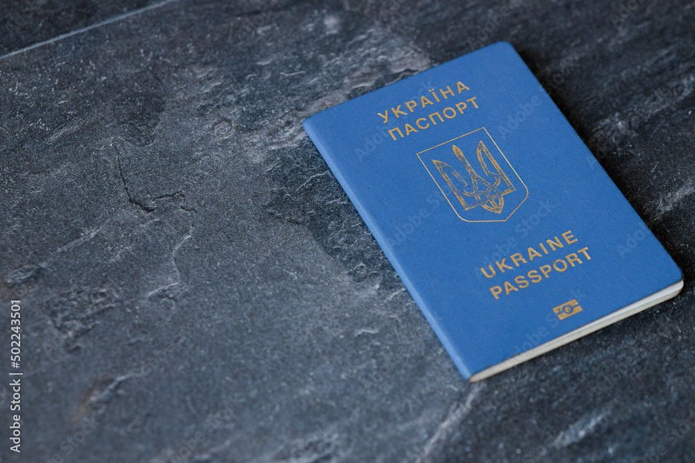 Passport of a citizen of Ukraine on a dark background, close-up ...