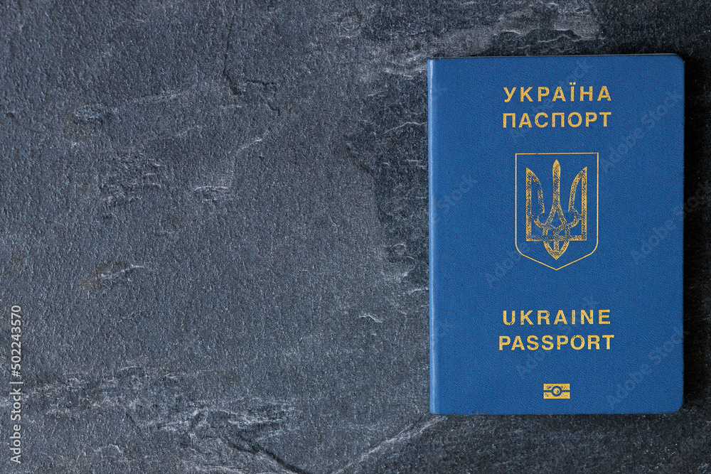Passport of a citizen of Ukraine on a dark background, close-up ...