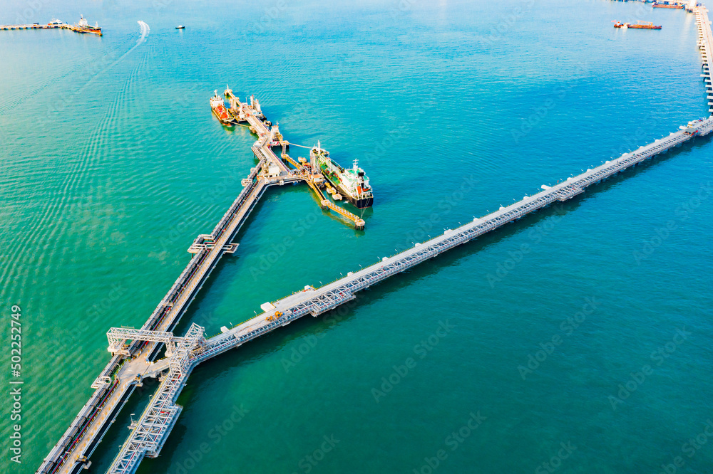 Pipeline for oil delivery ships. oil tanker container ship at sea ...