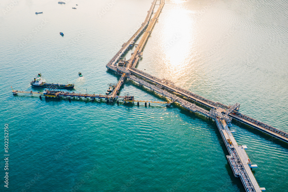 Pipeline for oil delivery ships. oil tanker container ship at sea ...