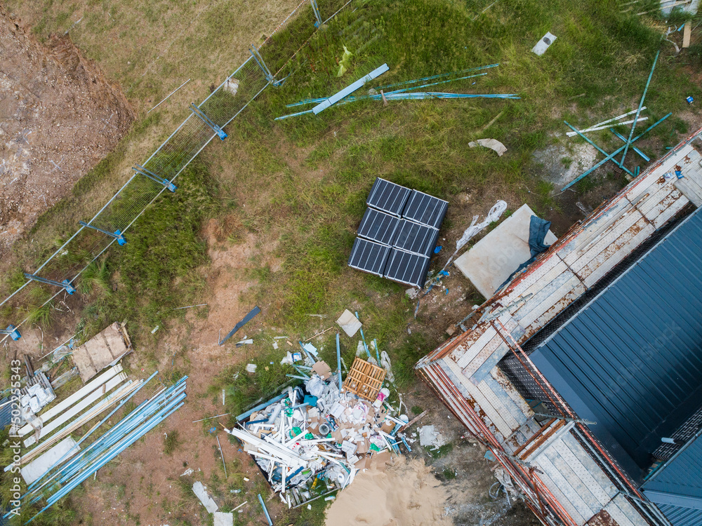 Messy construction worksite with scaffolding around house Stock Photo ...
