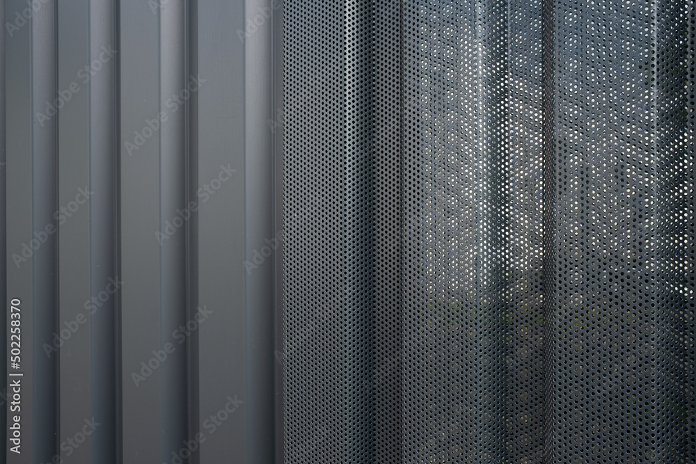 Texture of a perforated and corrugated sheet metal aluminum facade ...