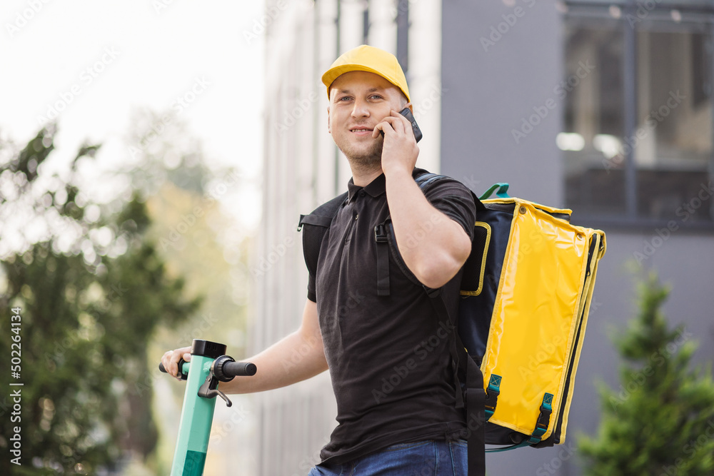 Food delivery guy with yellow backpack deliver orders. Male courier ...