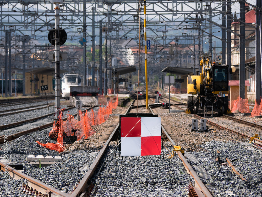 Train track under construction with a red and white sign preventing ...