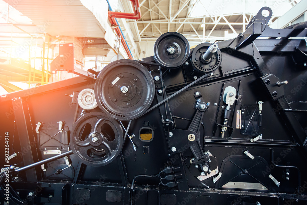 Mechanism of new modern agricultural combine harvester. Pulleys with ...