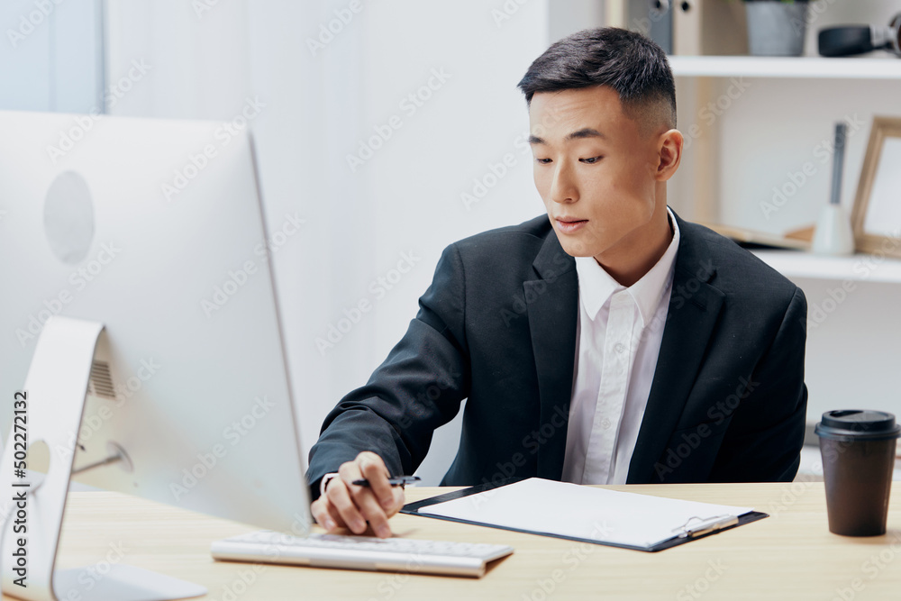 man sitting at a desk in front of a computer emotions Lifestyle Stock ...