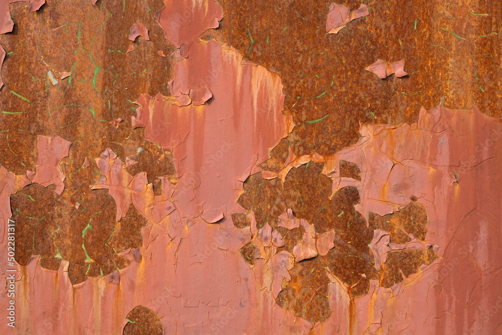 Rust-covered metal sheet background. An old shabby sunburned paint on ...