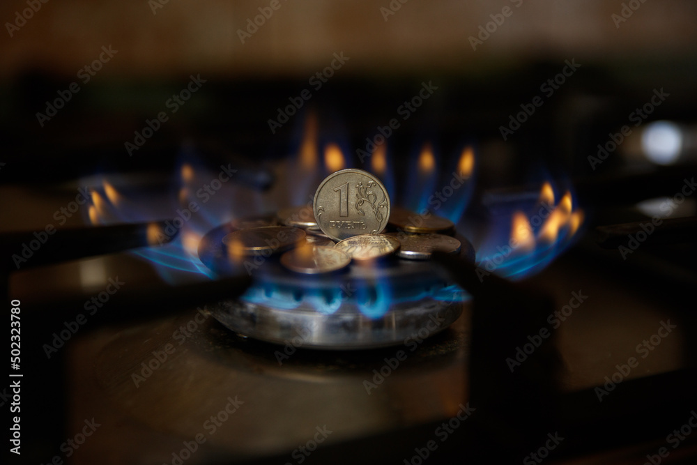 Coin 1 Russian ruble stands on a hot gas burner, burning gas stove ...