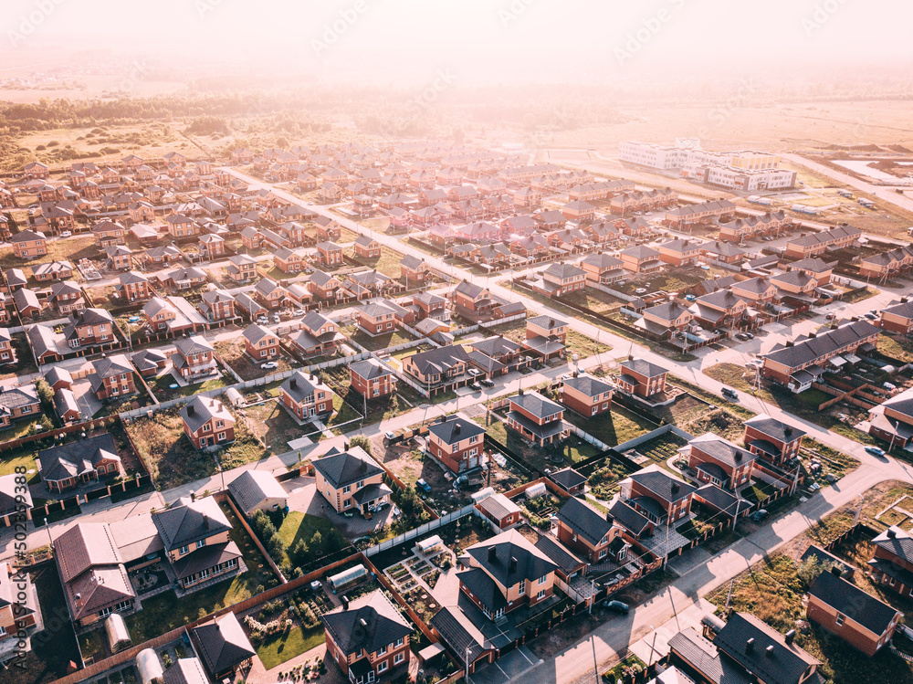 Aerial view of a luxurious village with smooth rows of two-storey ...