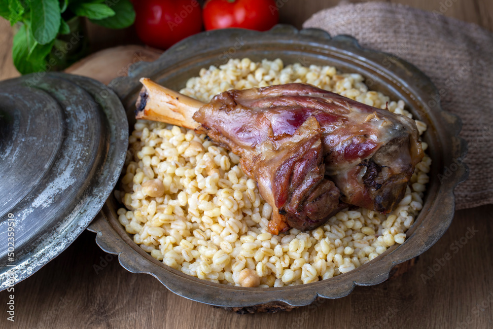 Turkish foods; lamb shank tandoori on bulgur wheat rice (Turkish name ...