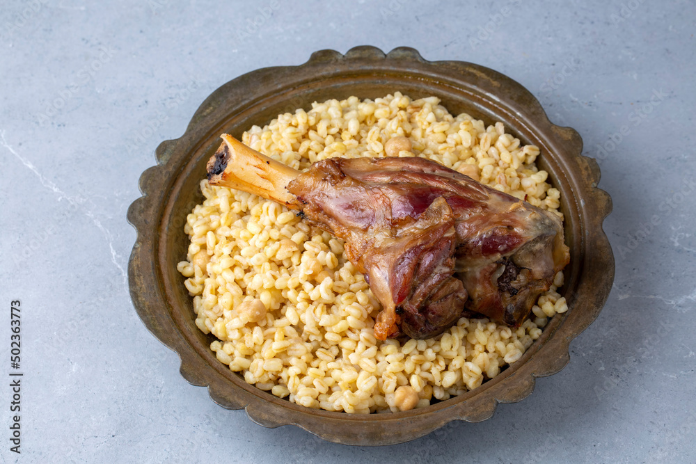 Turkish foods; lamb shank tandoori on bulgur wheat rice (Turkish name ...