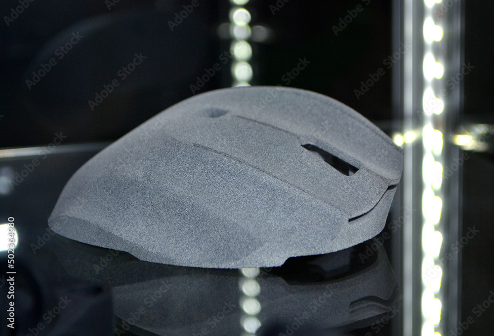 Gray computer mouse printed on 3D printer. Model printed on 3D printer ...