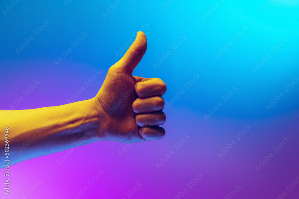 Human hand gesturing isolated on gradient purple-blue background in ...
