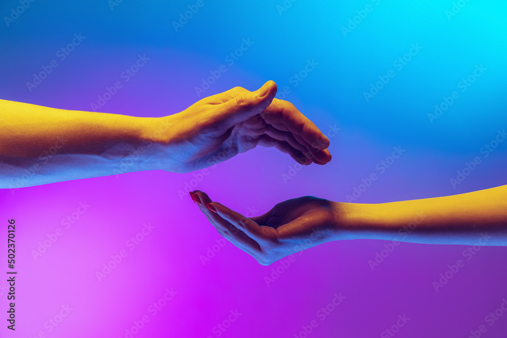 Two authentic hands trying to touch each other isolated on gradient ...