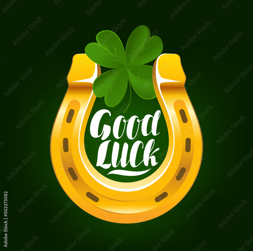 Golden horseshoe with four leaf clover. Calligraphy lettering ...