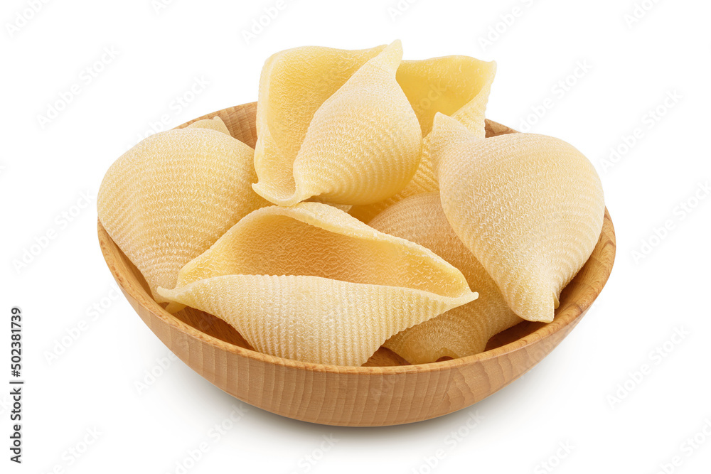 Conchiglioni italian pasta in wooden bowl isolated on white background ...